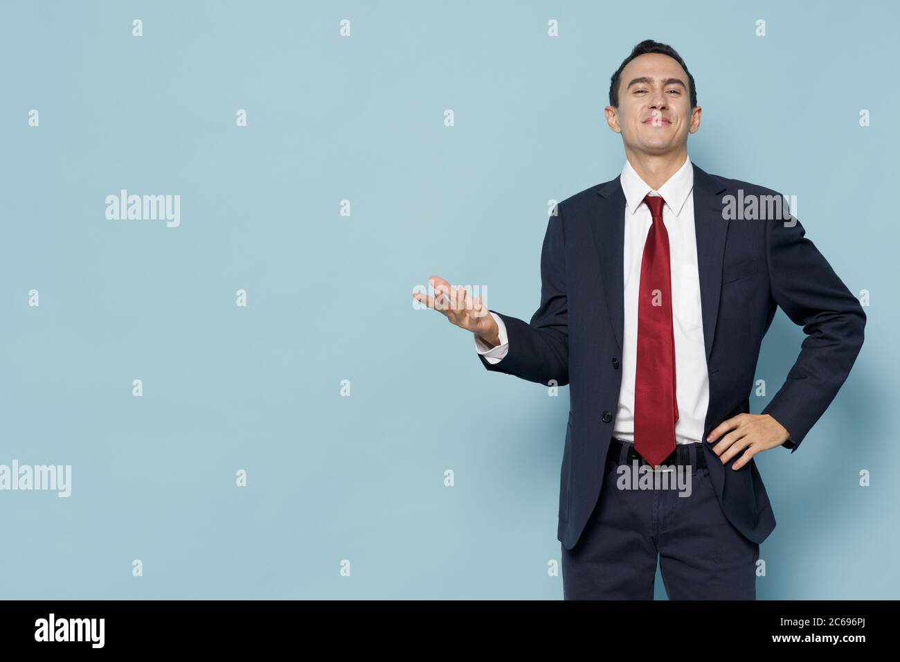 Confident businessman is gesturing with his hands and a classic suit ...