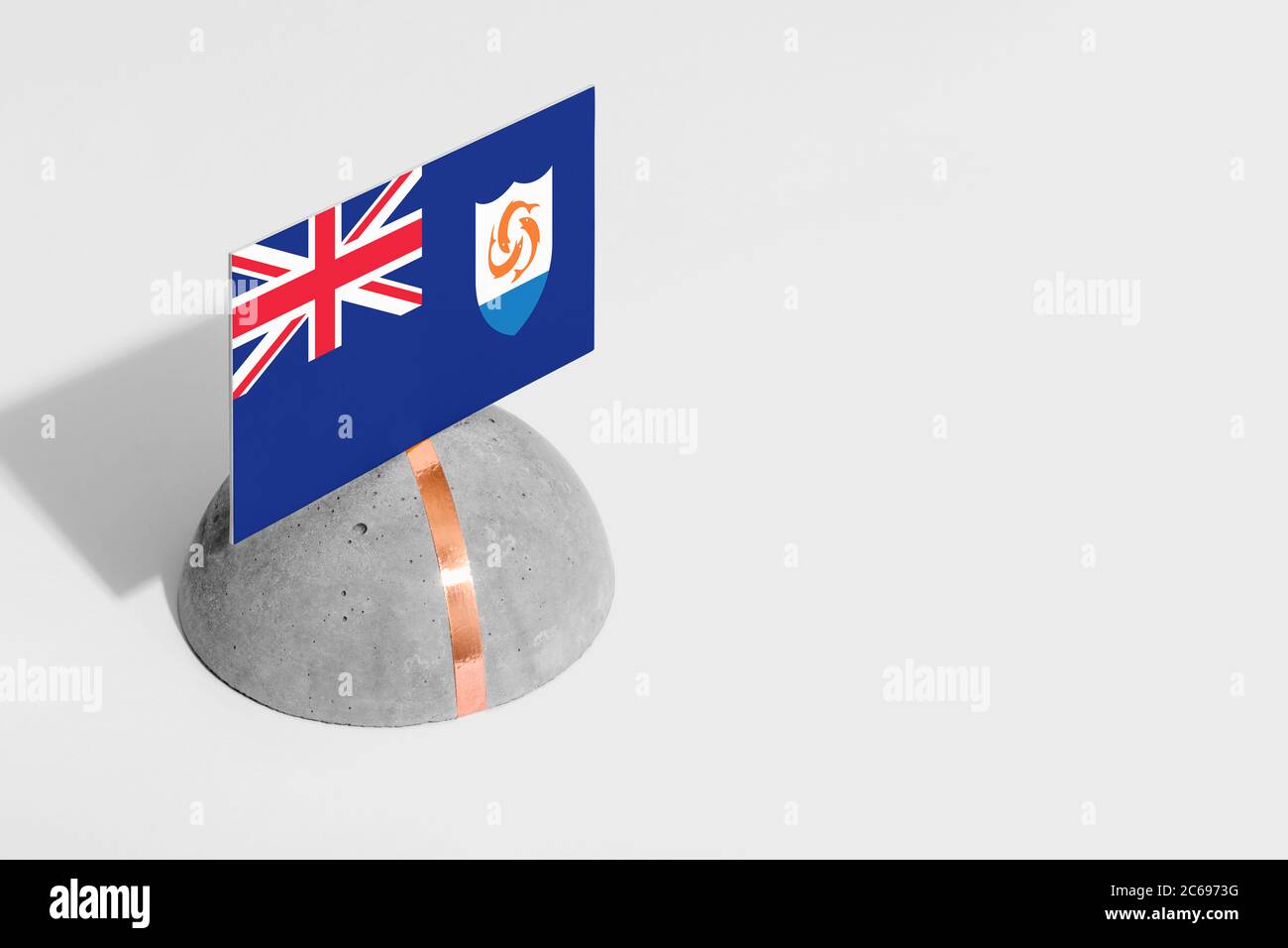 Anguilla flag tagged on rounded stone. White isolated background. Side ...