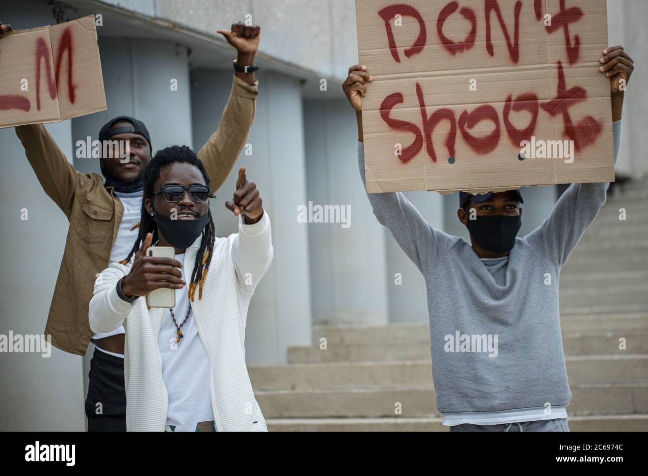 Demonstrators hold banners with the motto of the black civil rights ...