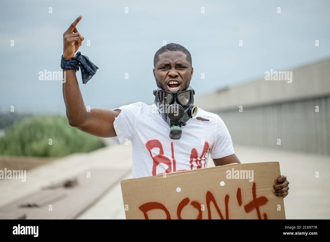 portrait of black man shouting in the streets while anti-racism protest ...