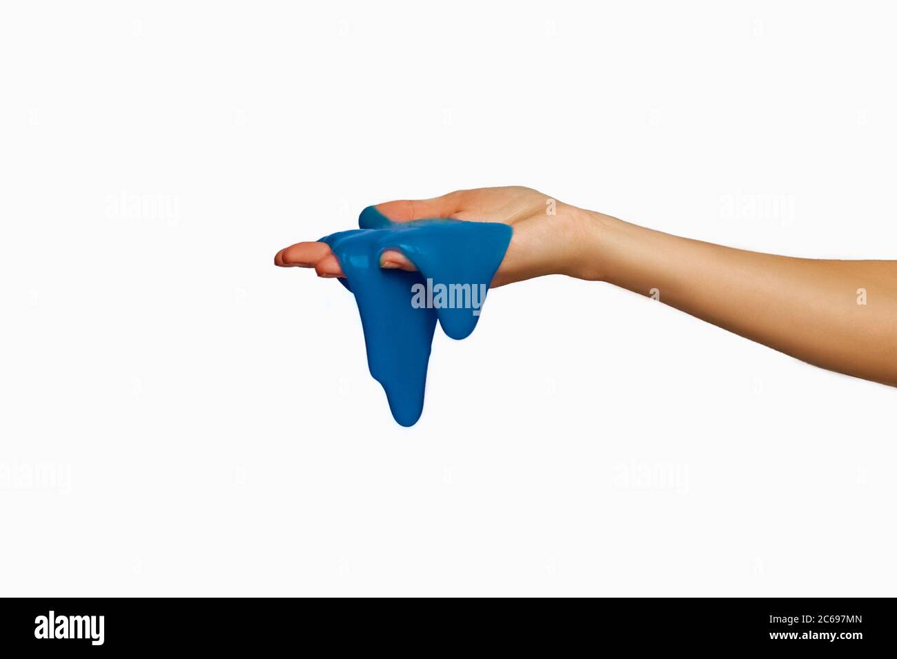 Blue slime in hand, isolated on white background. Kids play Stock Photo ...