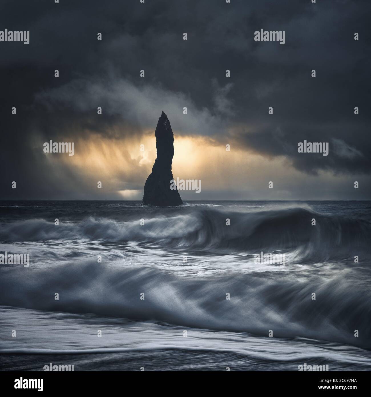 Reynisdrangar basalt sea stacks in ocean, South Central Iceland ...