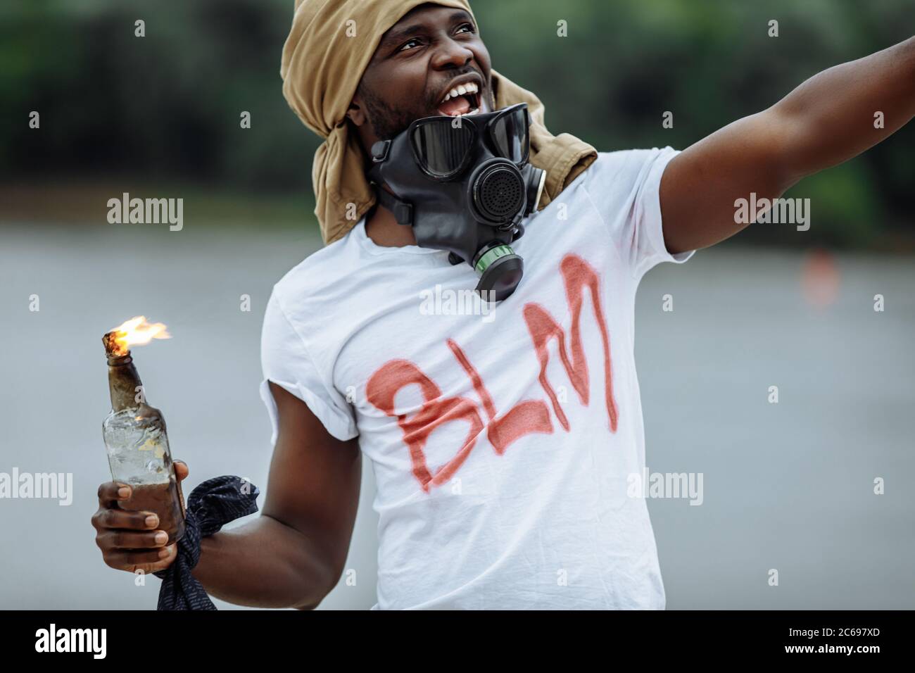 portrait of black african american man in gas mask, young guy with BLM ...