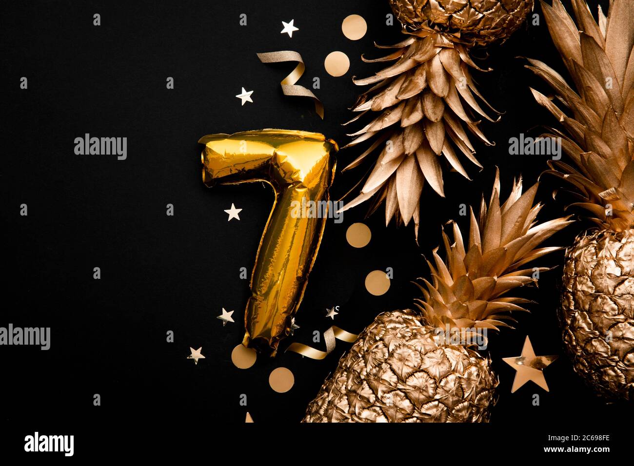 7th birthday celebration background with gold balloons and golden ...