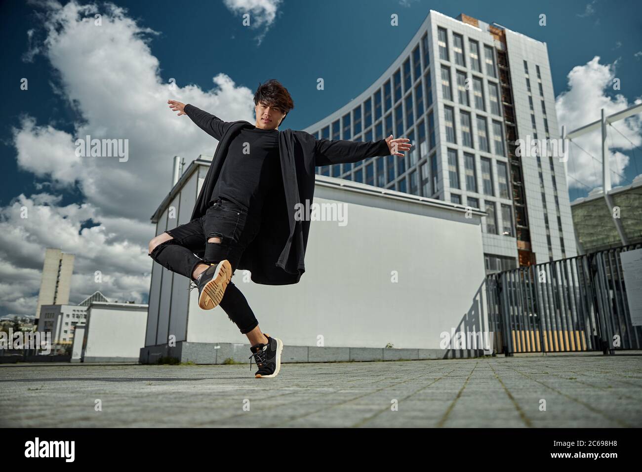 Young man doing parkour tricks hi-res stock photography and images - Alamy