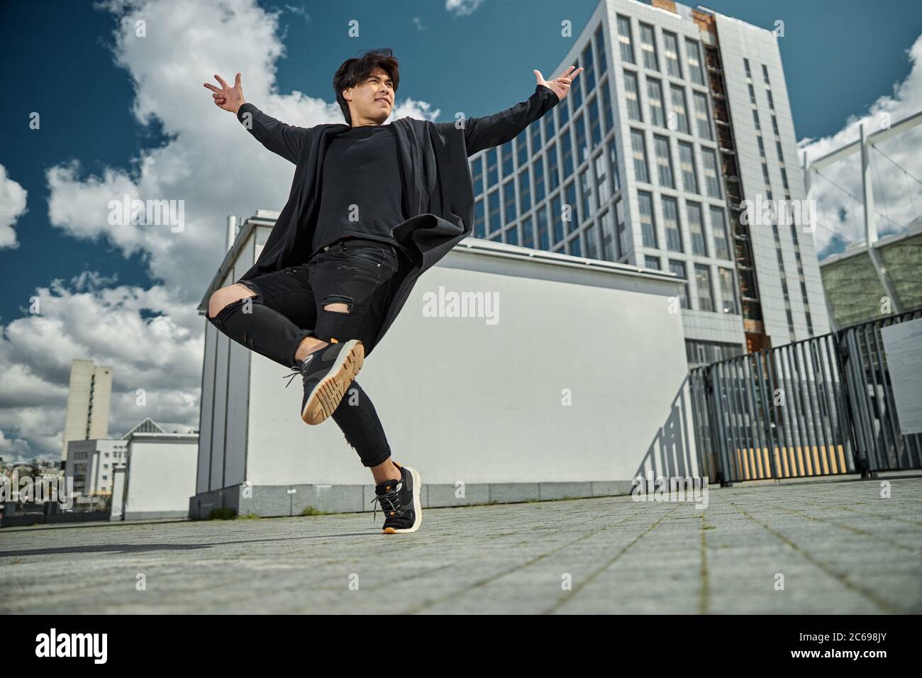 Young man doing parkour tricks hi-res stock photography and images - Alamy