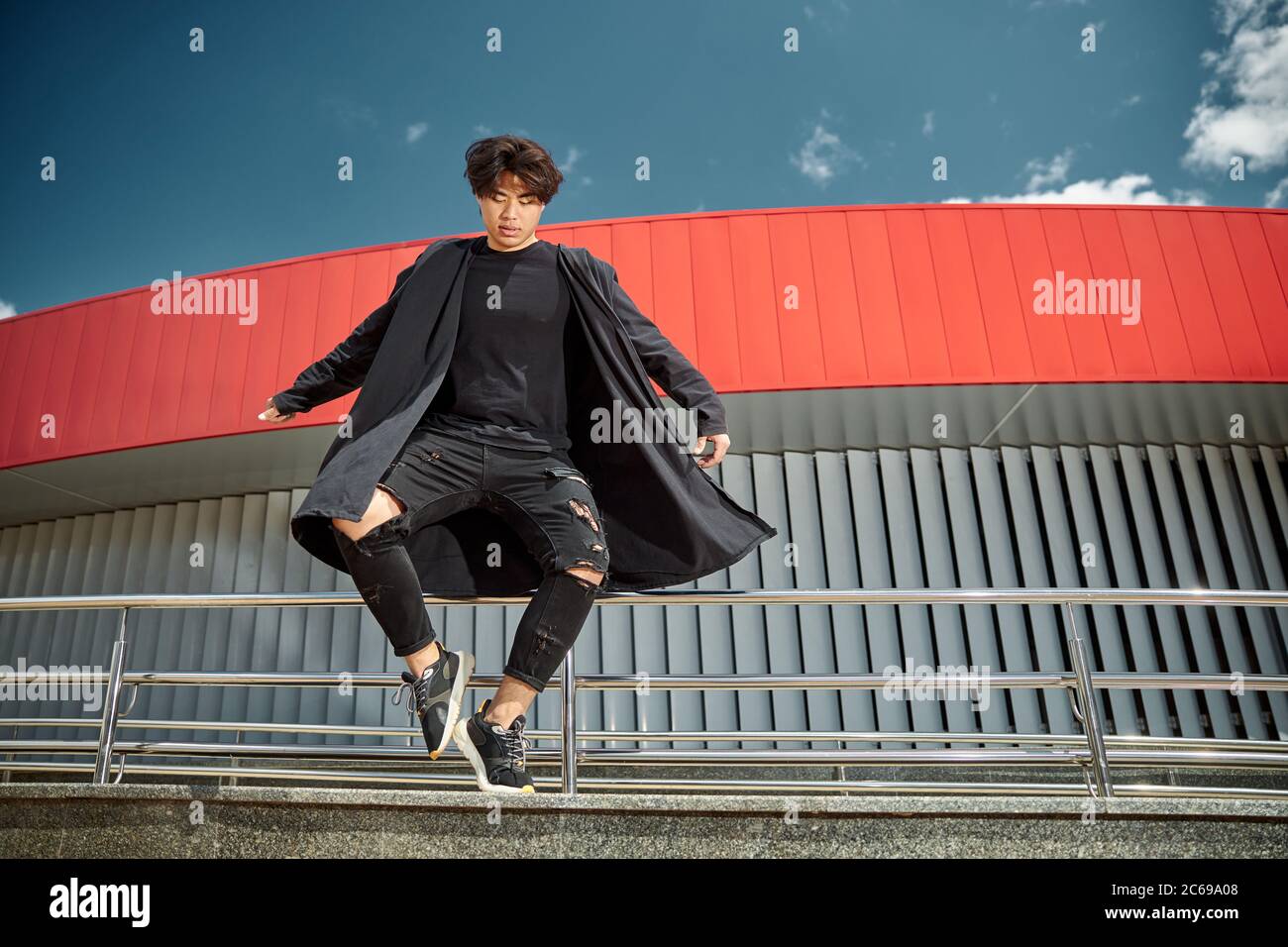 Young man standing on one leg hi-res stock photography and images - Alamy
