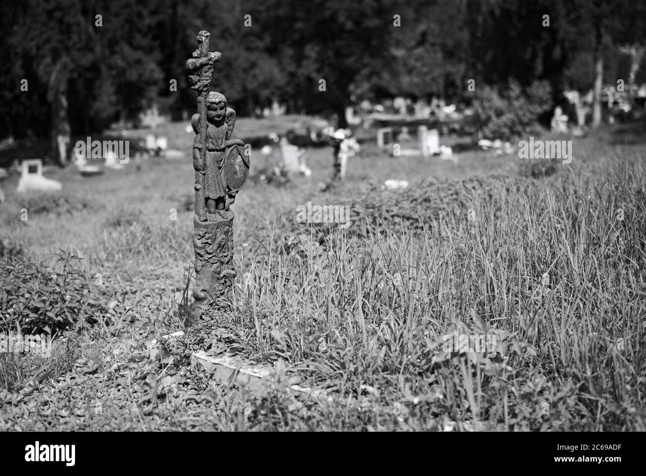 KOSICE, SLOVAKIA, 4 AUGUST 2019: Old rusty metal angel with a tall ...