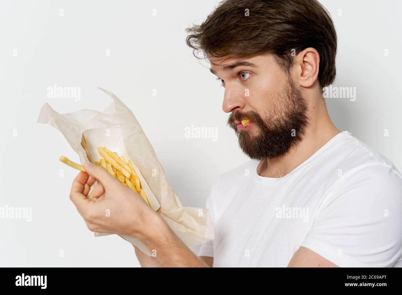Greedy young man close up hi-res stock photography and images - Alamy