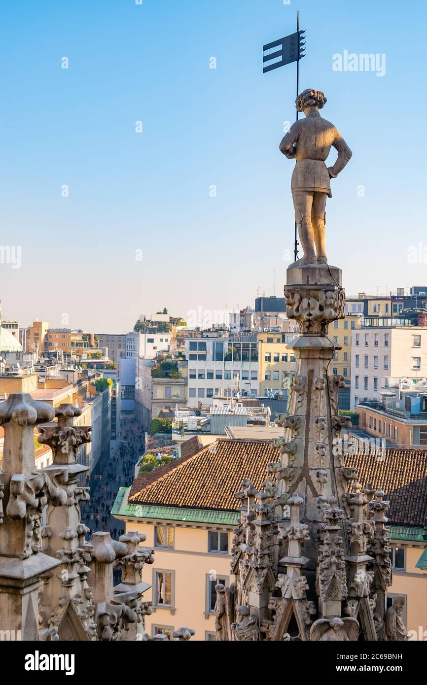 Rear view of religious statue of Duomo Milan Cathedral from the roof ...