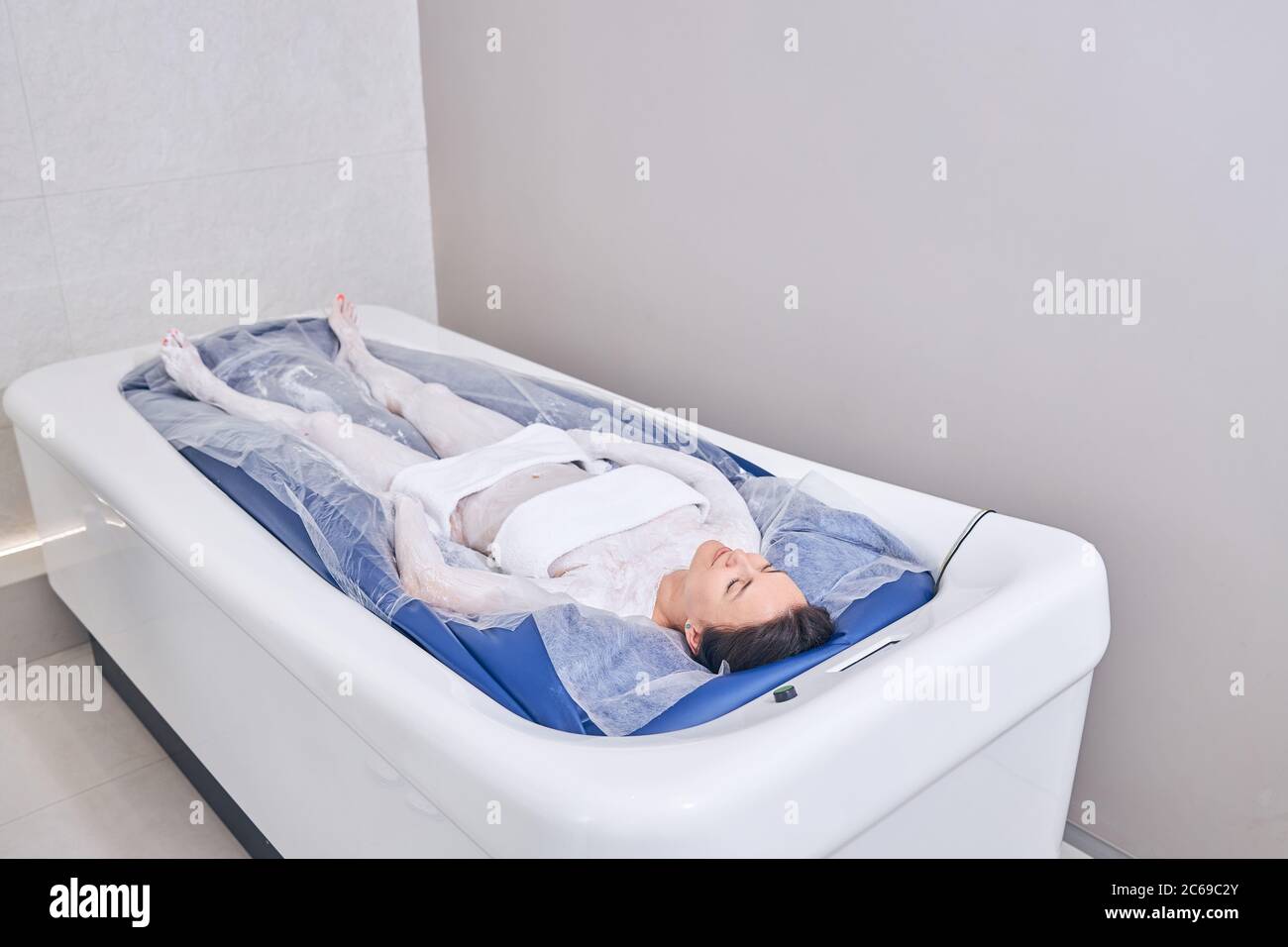 Modern floating machine and young woman relaxing on it Stock Photo - Alamy