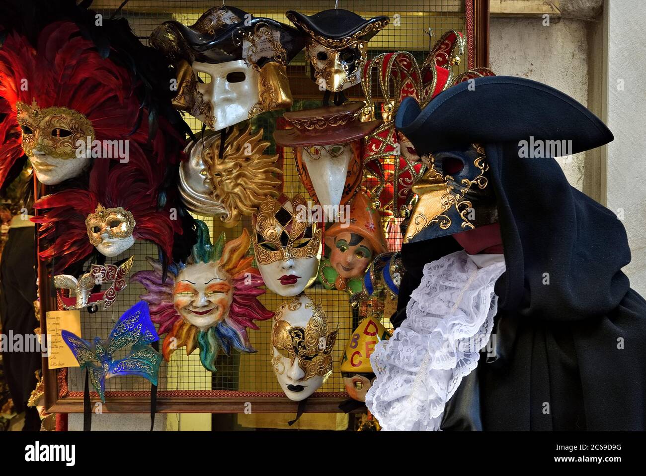 Traditional venetian masks and a medieval doctor costume. Venetian ...