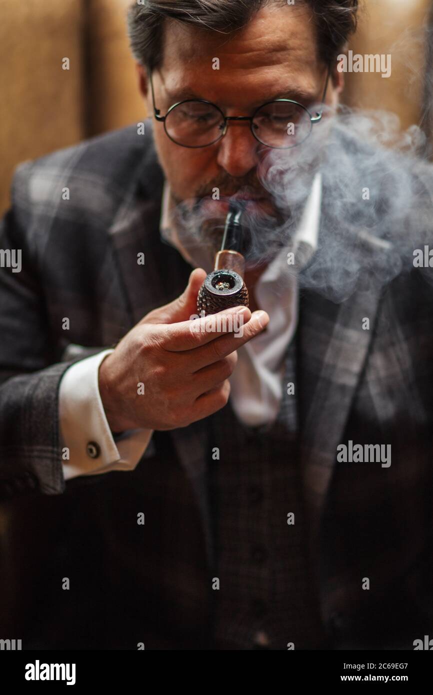 Mature experienced caucasian professor wears tweed jacket, looks ...