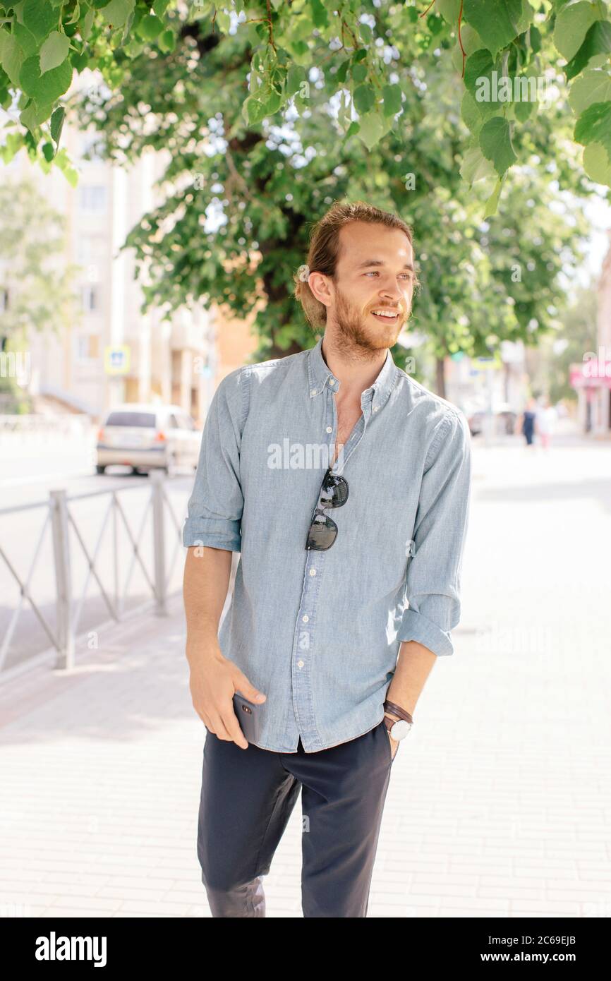 Handsome man walking on city hi-res stock photography and images - Alamy