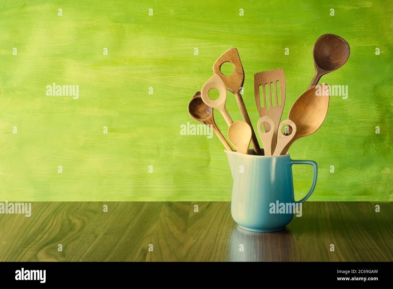rustic kitchen utensils in an old jug, good copy space on the ...
