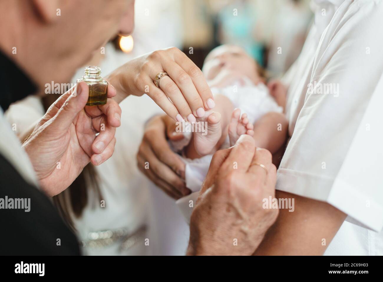 baptism ceremony in the church. priest performing a ritual Stock Photo ...