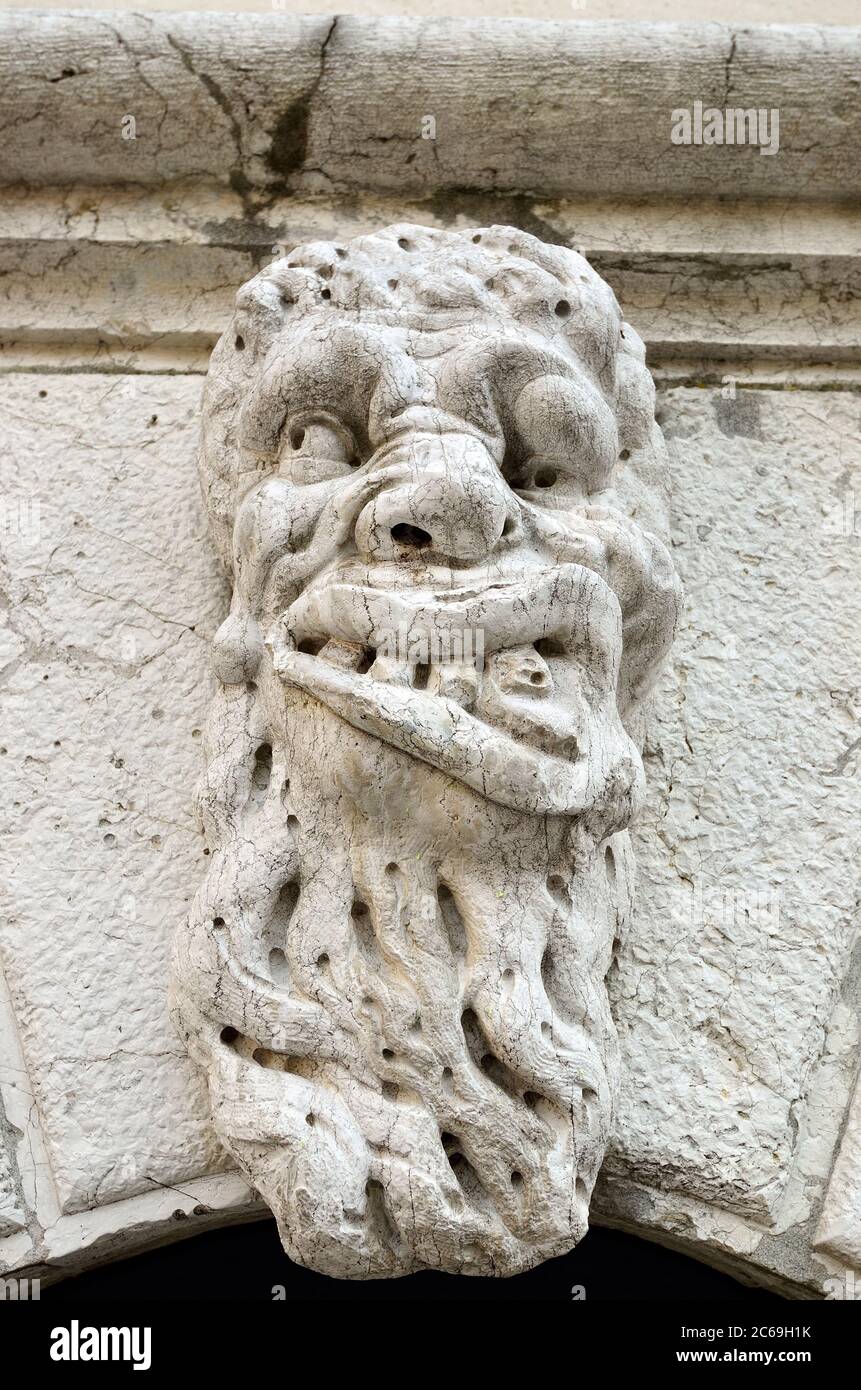 Devil head relief on a facade of a medieval house, Venice, Italy Stock ...