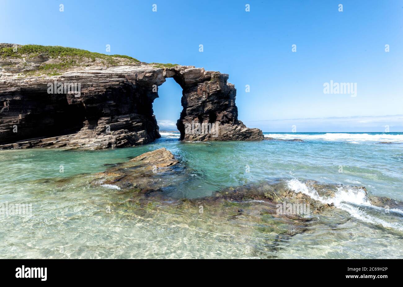 Natural arch in Cathedrals beach. Beautiful beach in Ribadeo. Tourism ...