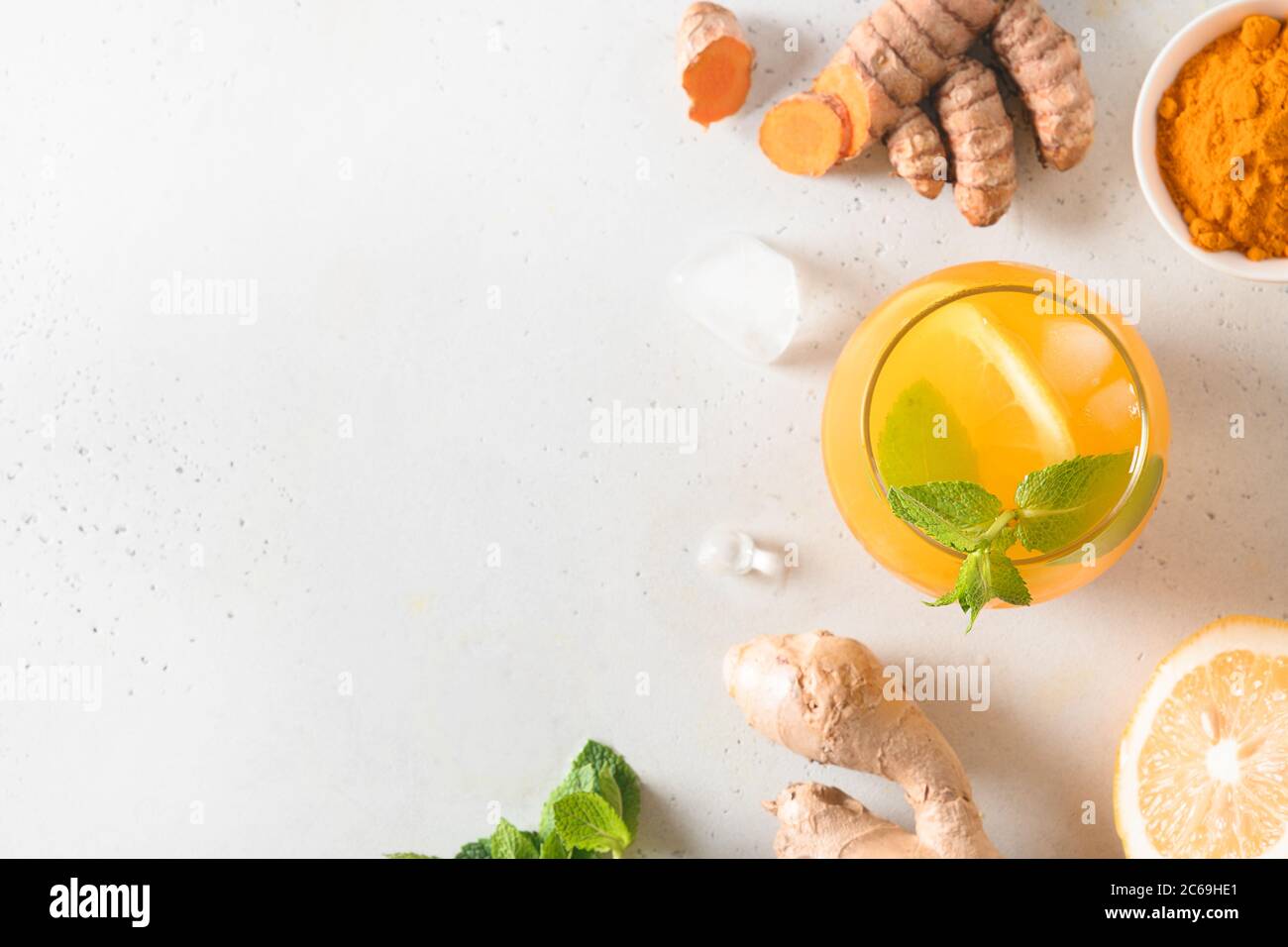 Jamu herbal beverage with natural ingredients turmeric, ginger on white ...