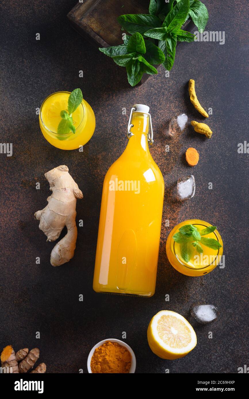Jamu Indonesian herbal beverage in bottle with turmeric, ginger on ...