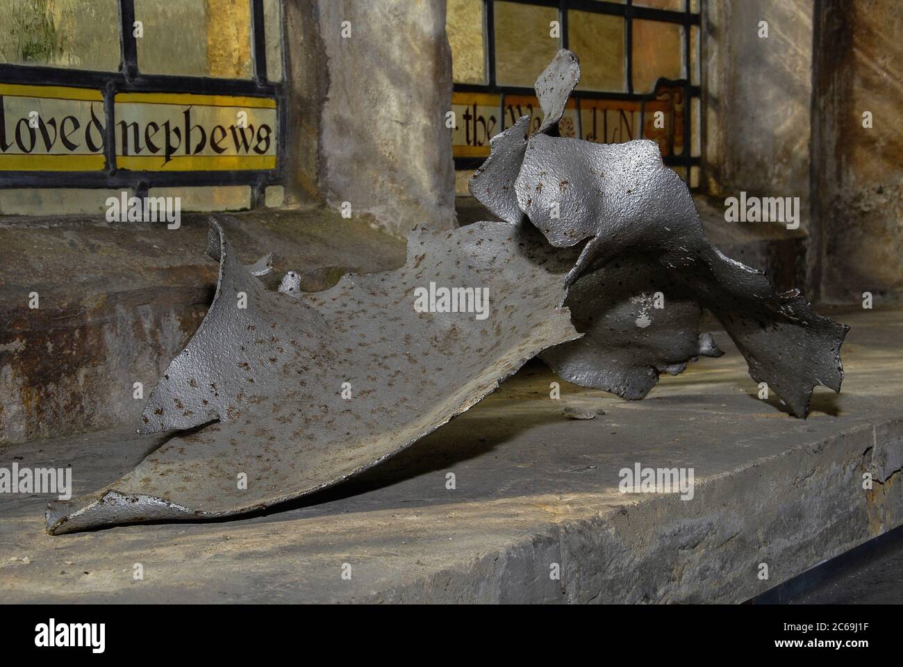 Twisted shard of metal shrapnel, now displayed on windowsill in Parish ...