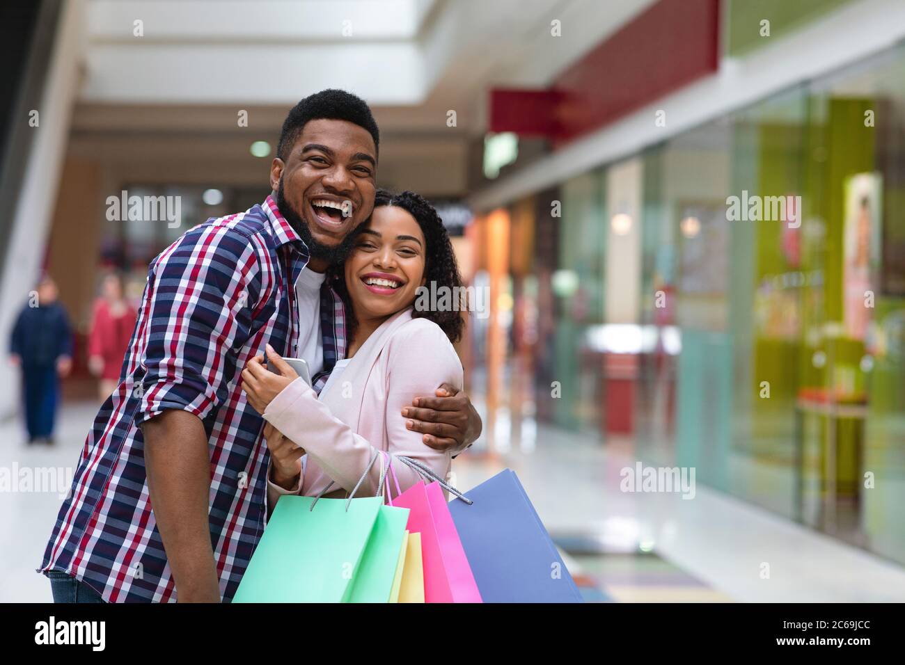 Happy Buyers. Cheerful African Couple Posing In Department Store After ...