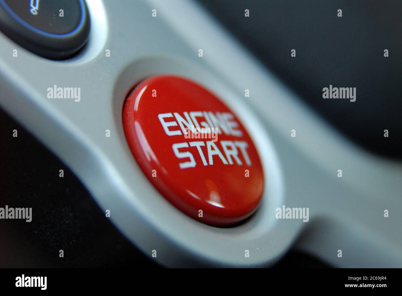 Start stop engine button on a modern sports car steering wheel Stock ...