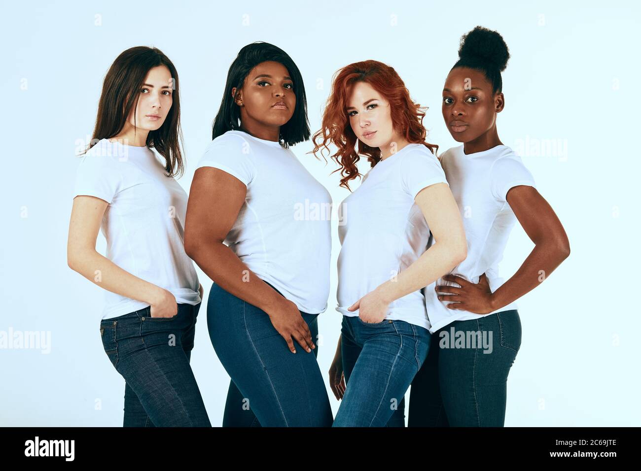 Four confident young multi ethnic female models of different race, body ...