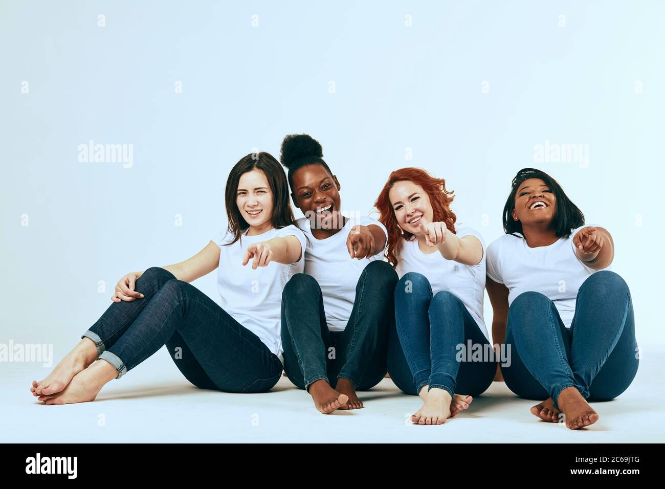 Four young multi ethnic female models of different race, body size and ...