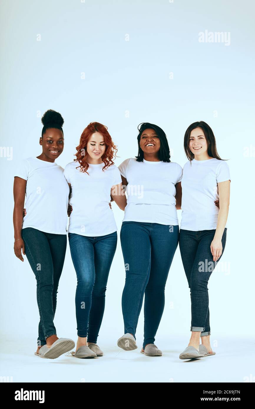 Four young multi ethnic female models of different race, body size and ...