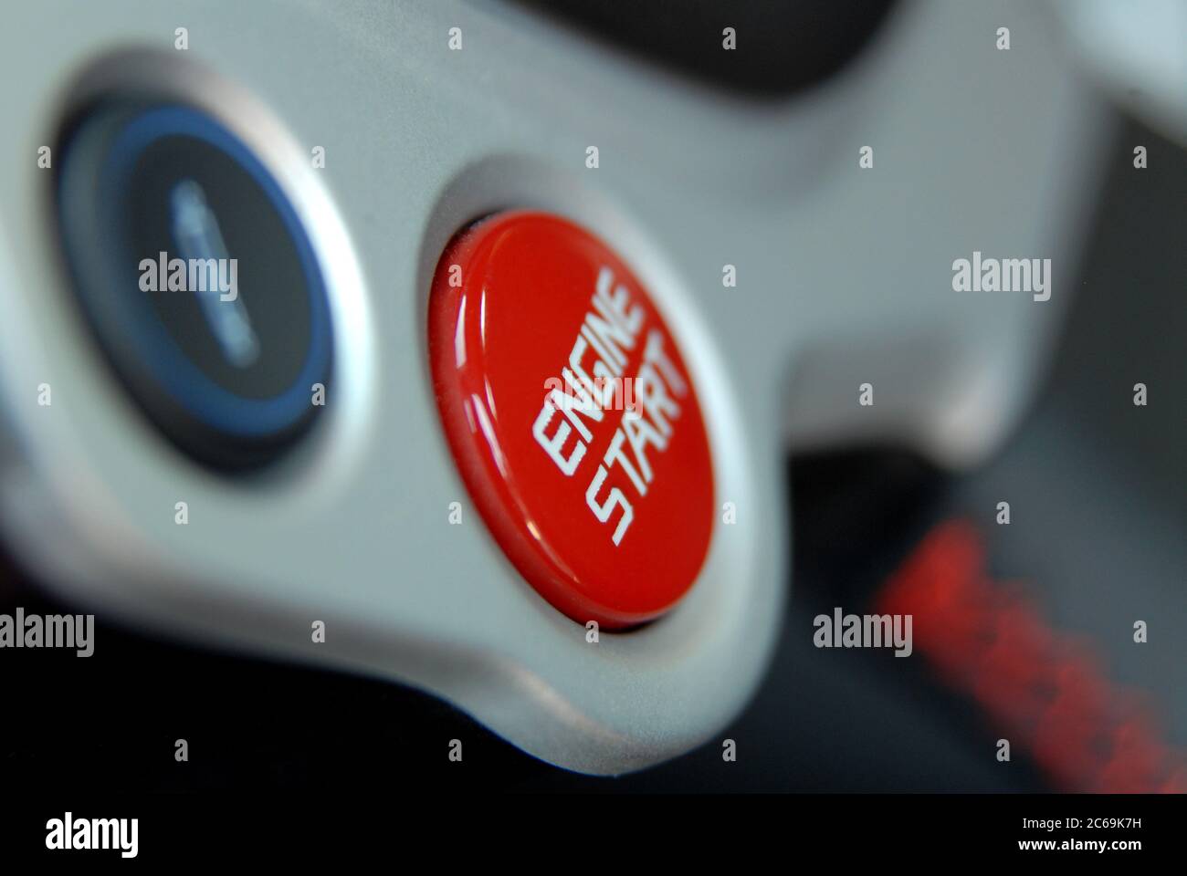 Start stop engine button on a modern sports car steering wheel Stock ...