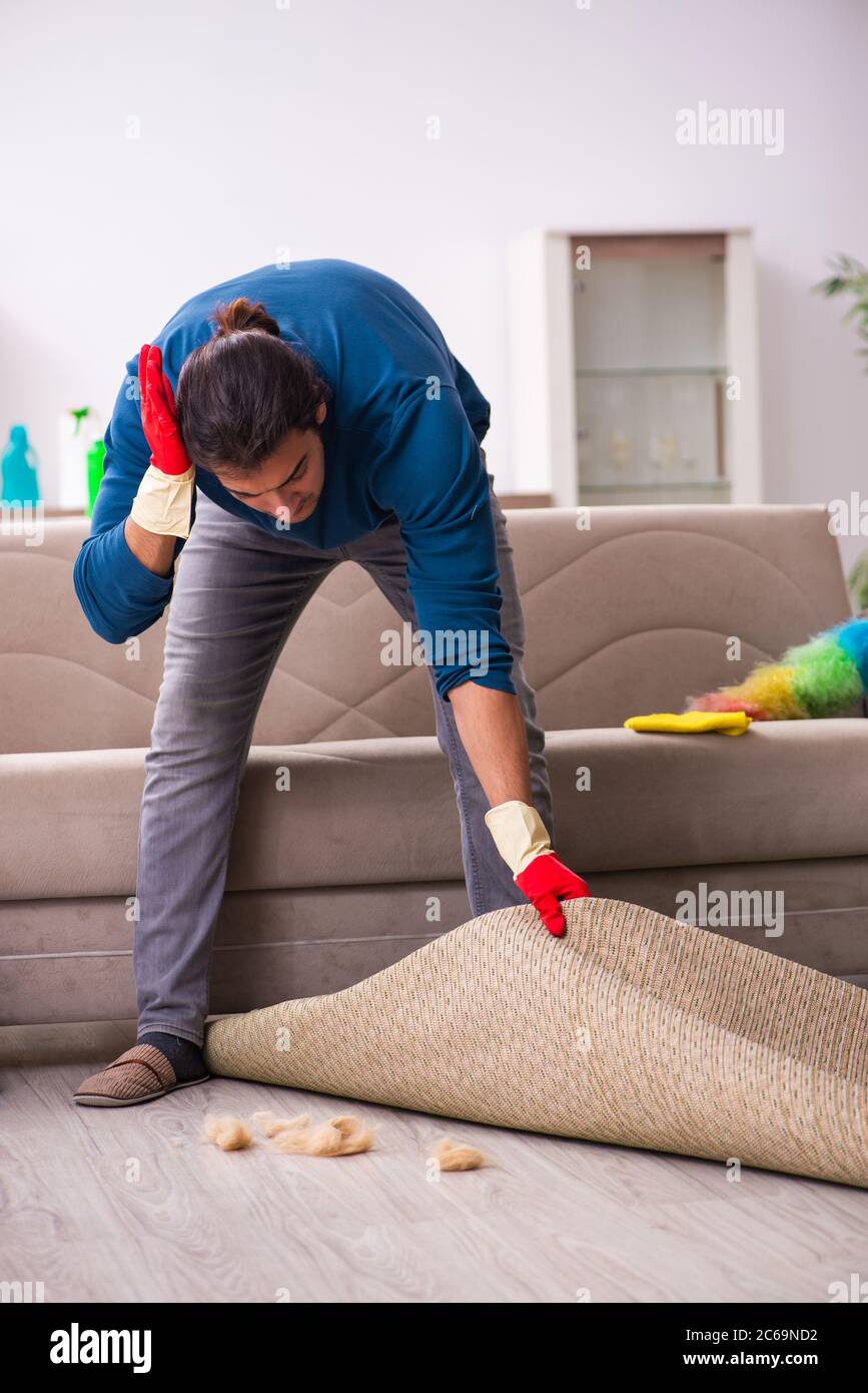 Young man husband doing housework Stock Photo - Alamy