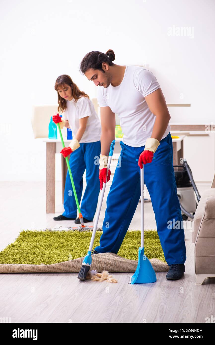 Young pair doing housework at the home Stock Photo - Alamy