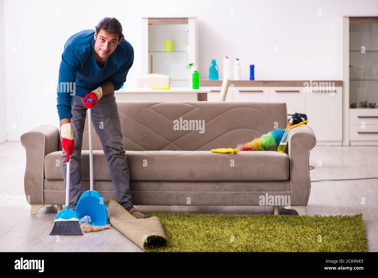 Young man husband doing housework Stock Photo - Alamy