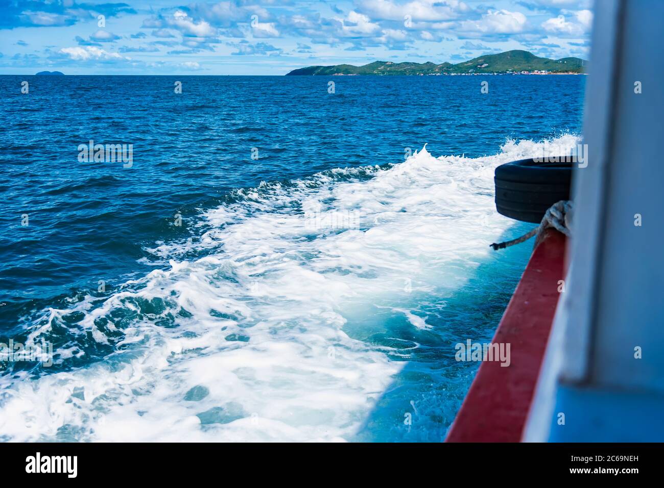 Water blue ocean splash and boat in the sea way ,Waves splashing on the ...