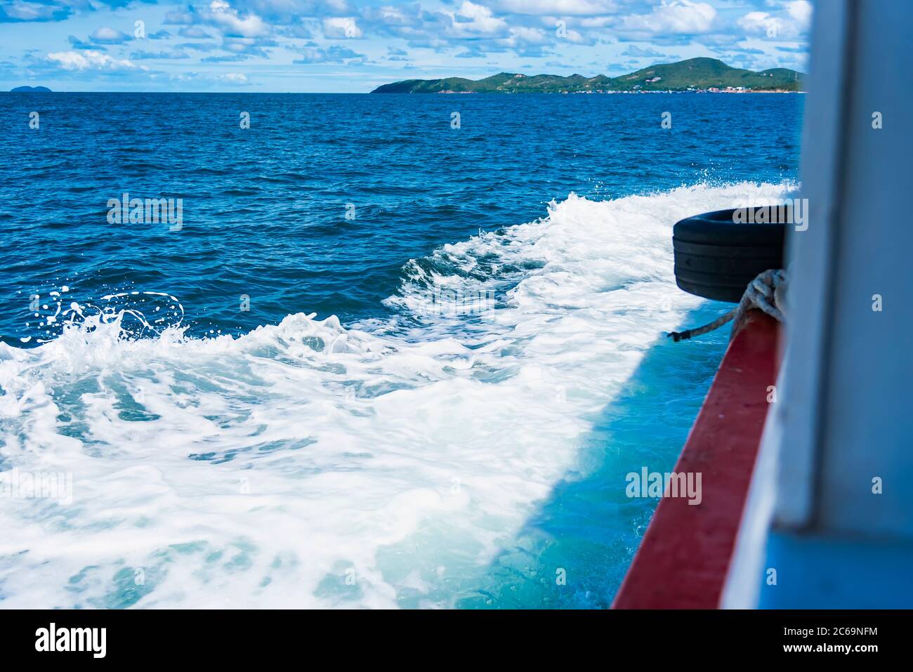 Water blue ocean splash and boat in the sea way ,Waves splashing on the ...