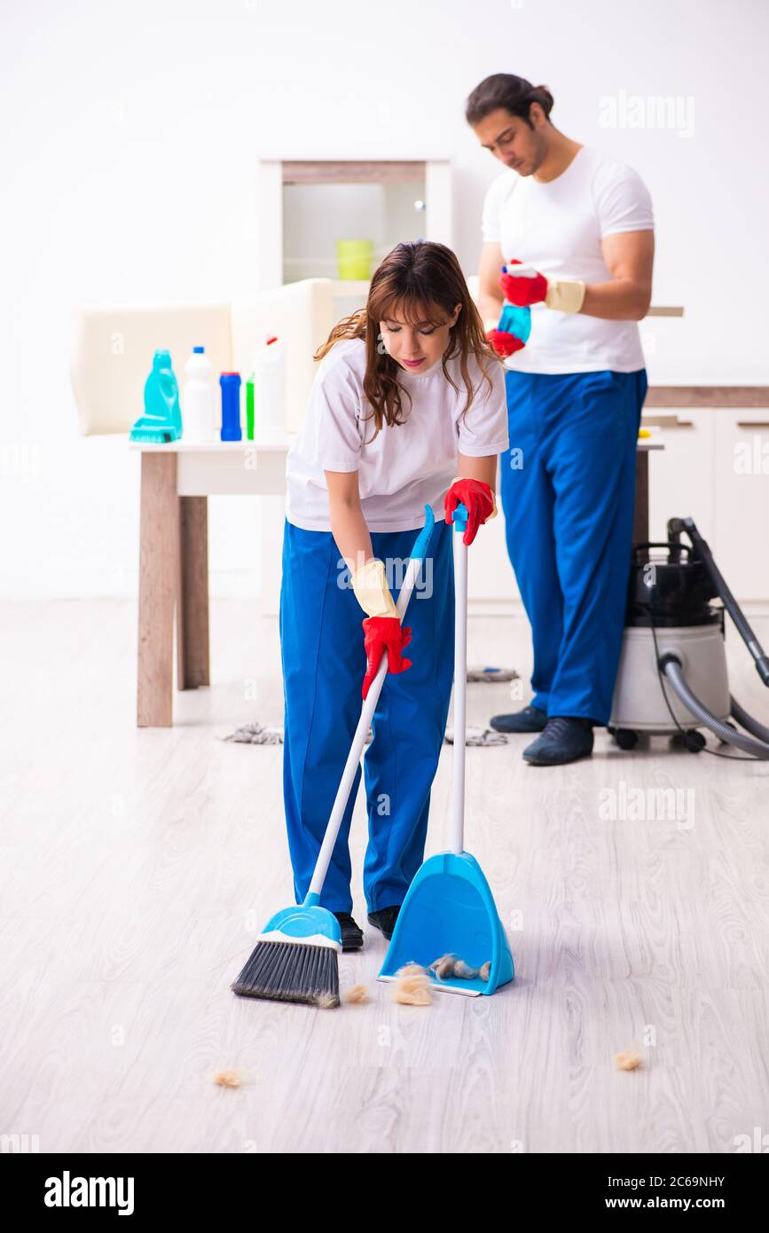 Young pair doing housework at the home Stock Photo - Alamy
