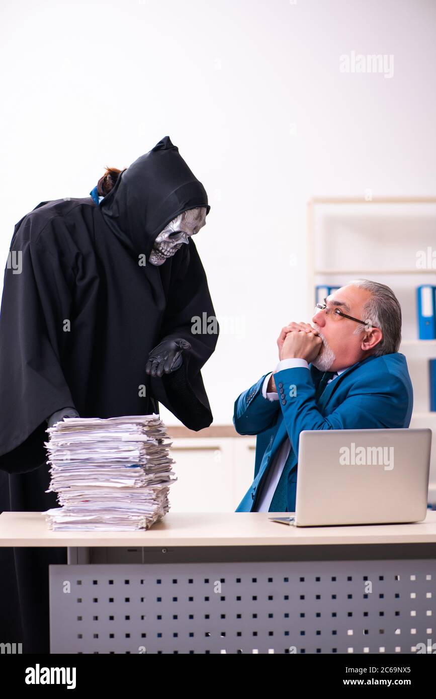 Old businessman employee making deal with the devil Stock Photo - Alamy