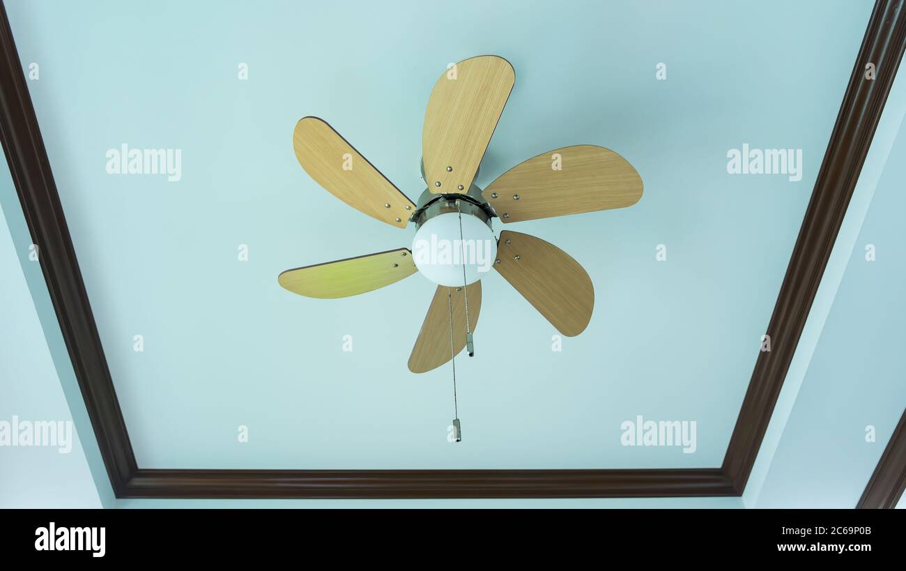 Electric ceiling fan with lamp Stock Photo - Alamy