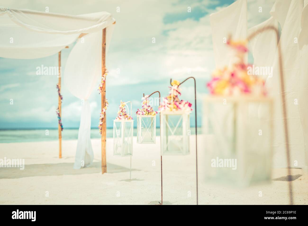 Romantic beach ceremony setup with colorful sky. Luxury beach wedding ...