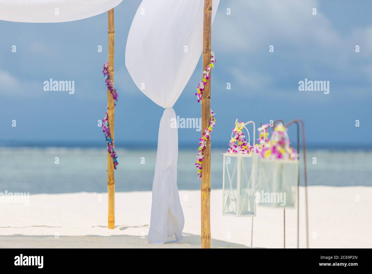Romantic beach ceremony setup with colorful sky. Luxury beach wedding ...