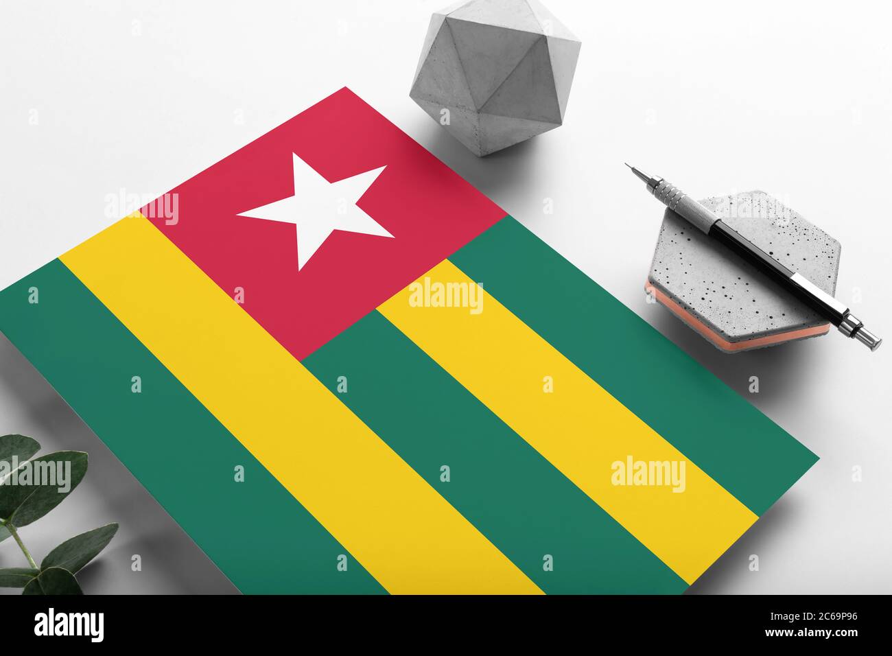 Togo flag on minimalist paper background. National invitation letter ...