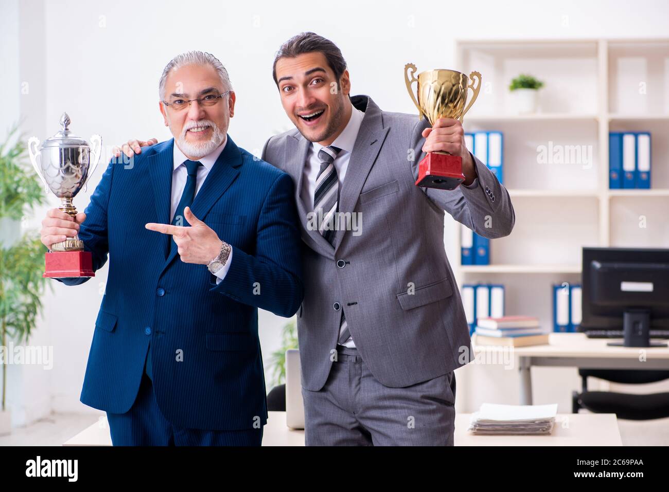 Two employees working in the office Stock Photo - Alamy