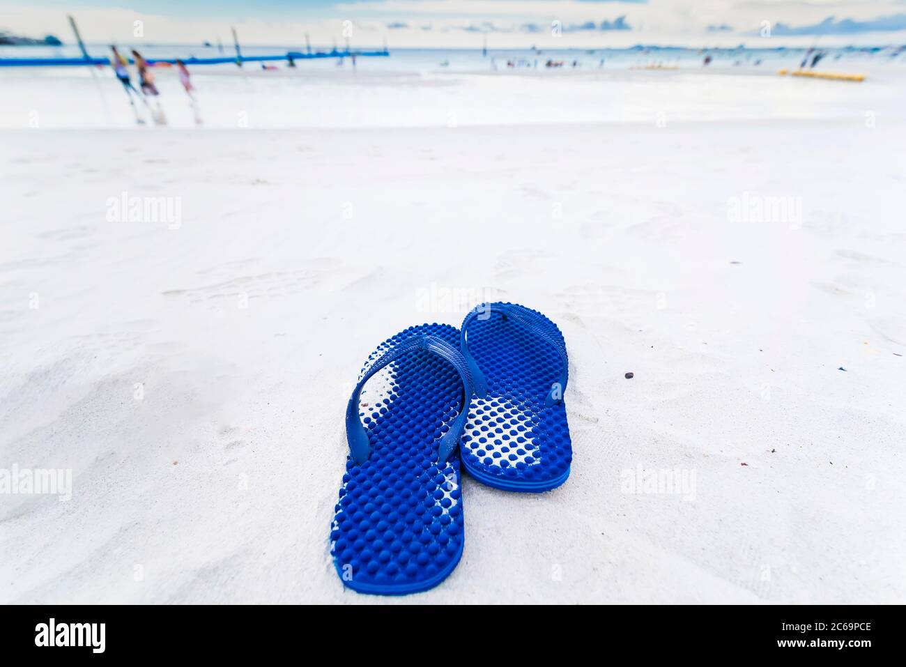 Pair of sandals on sandy beach hi-res stock photography and images - Alamy