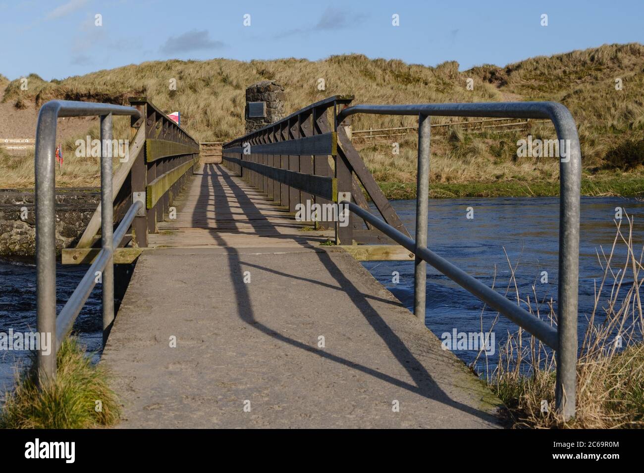 The bridge over the River Bush at Runkerry Beach near Portballintrae in ...