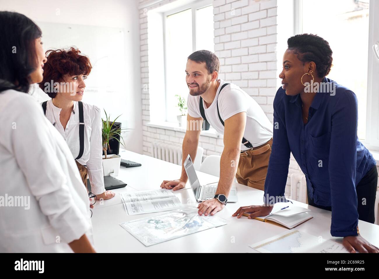 Group of multiethnic business people in formal suit standing near table ...