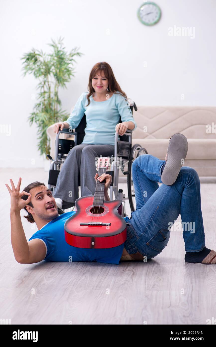 Disabled wife and husband at home Stock Photo - Alamy