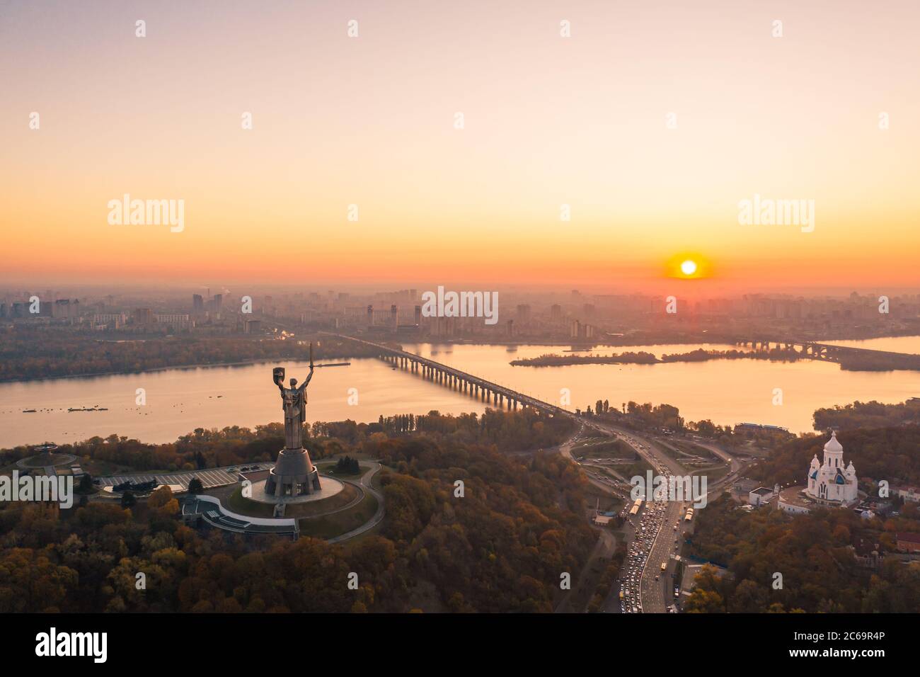 Kiev skyline over beautiful fiery sunset, Ukraine. Monument motherland ...