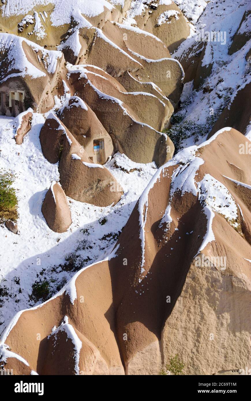 View of Cappadocia. Turkey. Unusual winter landscape with cliff at ...