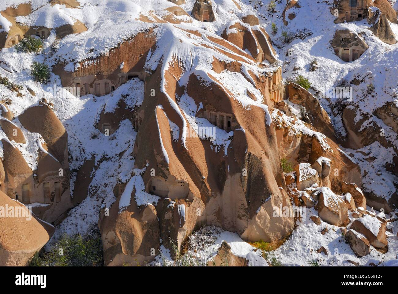 View of Cappadocia. Turkey. Unusual winter landscape with cliff at ...